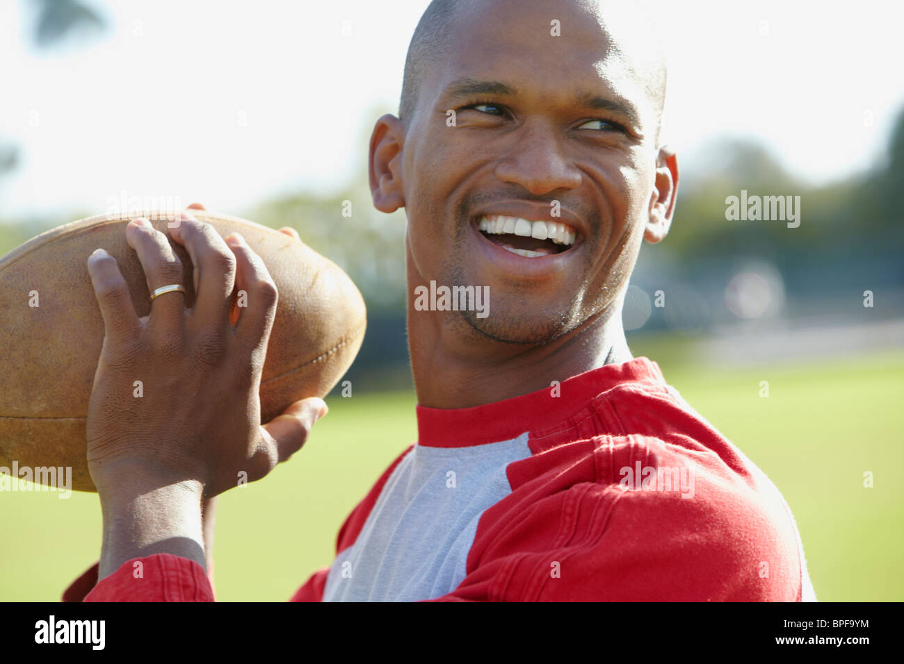 African American man throwing football Stock Photo - Alamy