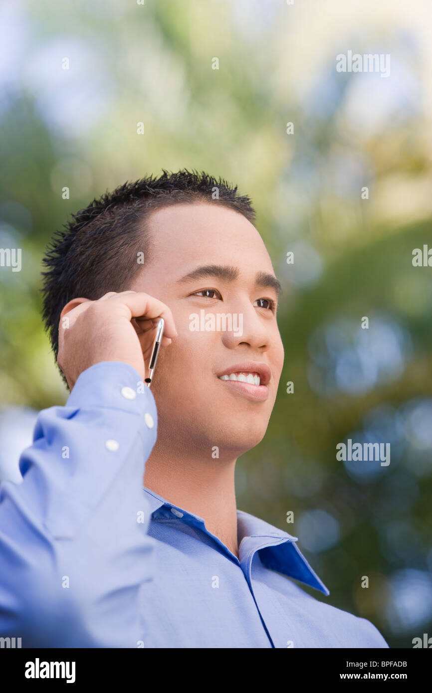Chinese man using cell phone Stock Photo - Alamy