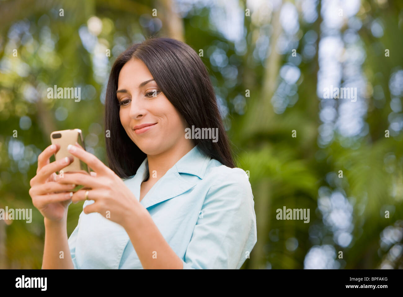 Turkish woman text messaging on cell phone Stock Photo - Alamy