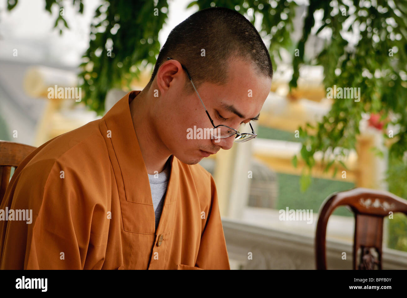 Monk studying in Xian, China Stock Photo - Alamy