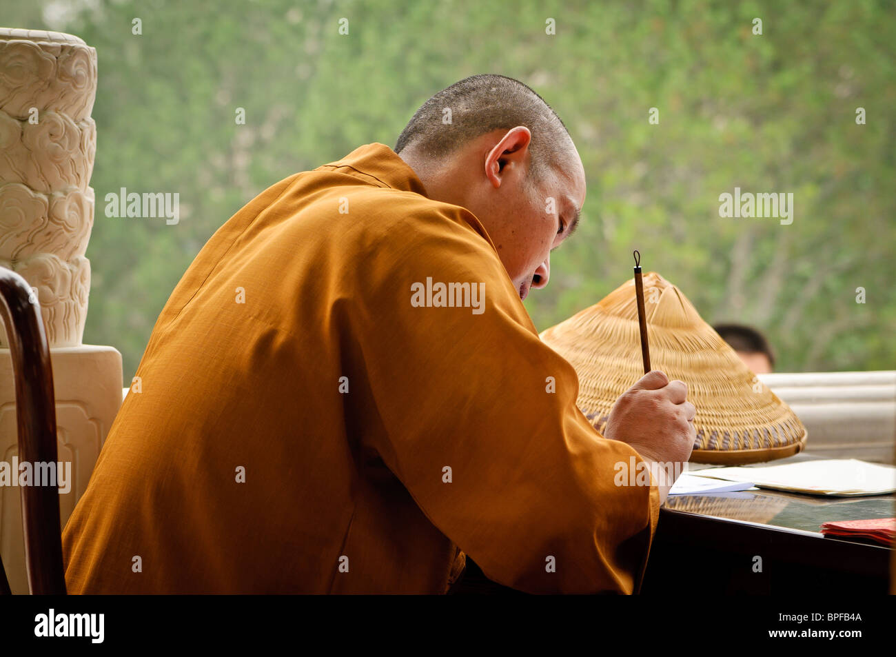 Monk studying in Xian, China Stock Photo - Alamy