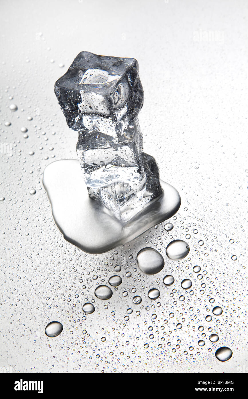Melting ice cubes on a metal tabletop Stock Photo - Alamy