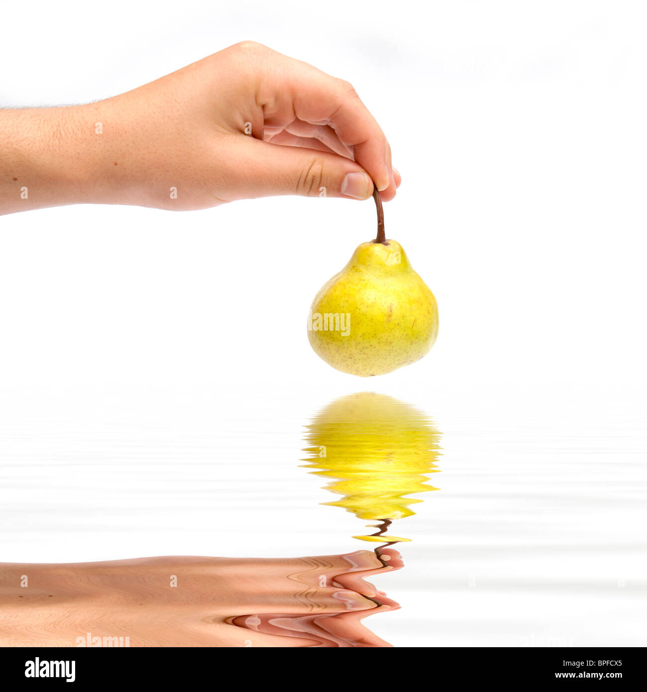 Hand Giving a Pear Stock Photo - Alamy