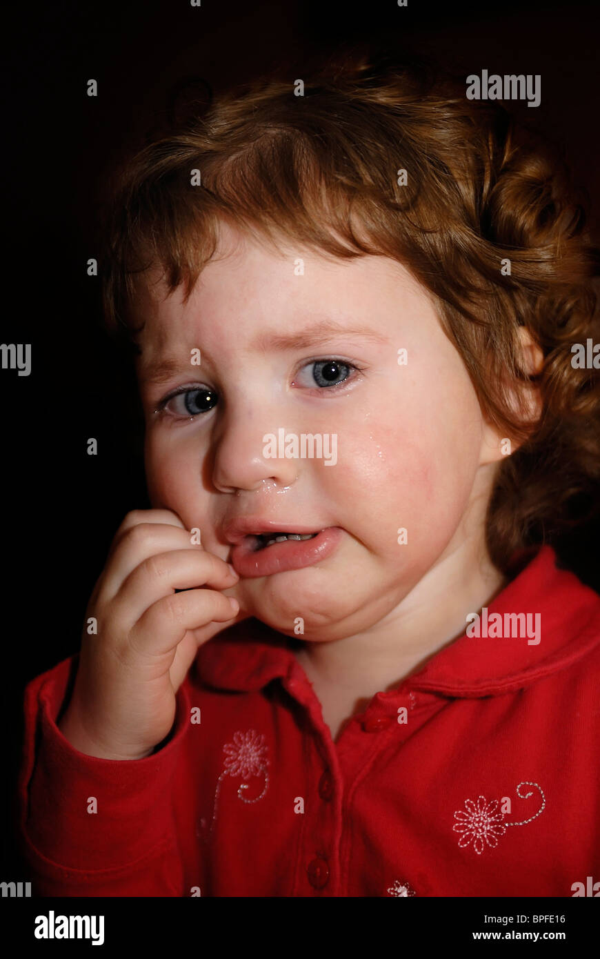 Little Girl crying in darkness Stock Photo - Alamy