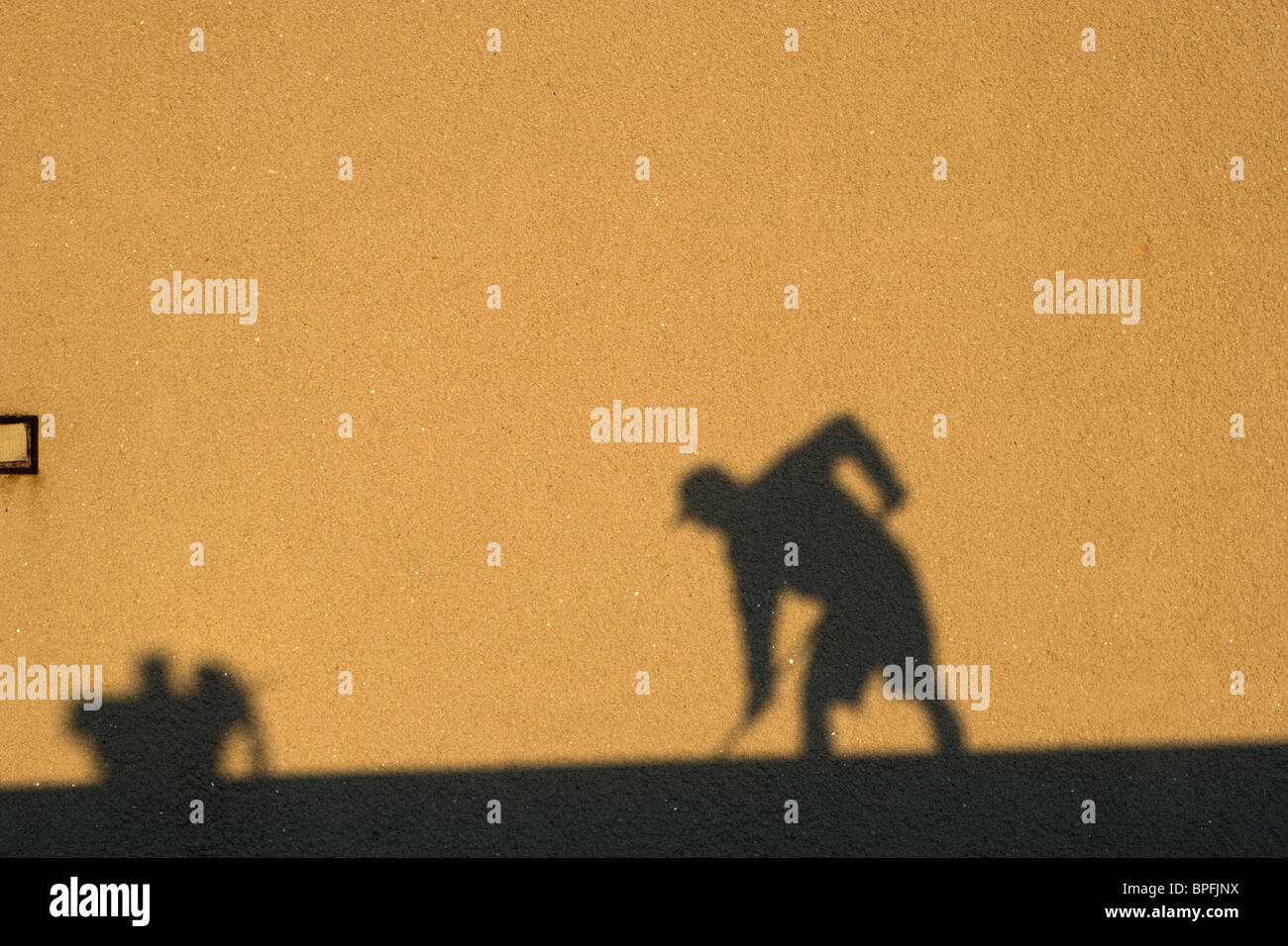 shadow of the man by the work on the roof Stock Photo - Alamy