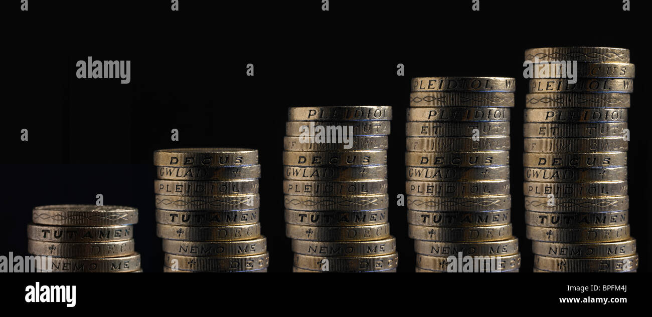 Piles Of Pound Sterling Coins On A Black Background Stock Photo - Alamy