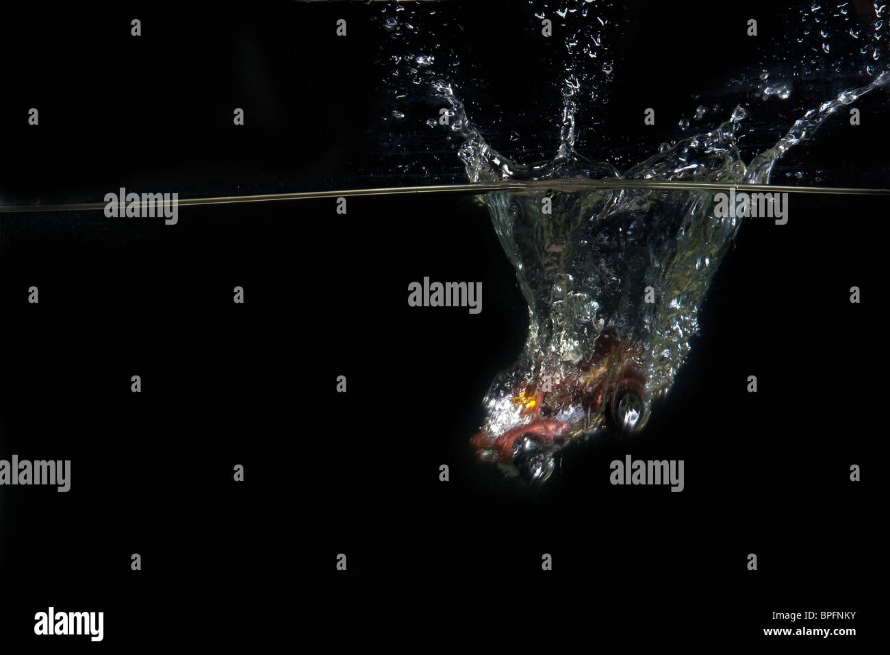 Object is dropped into water Stock Photo - Alamy