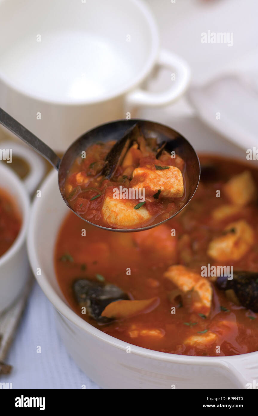seafood chowder and serving spoon Stock Photo - Alamy