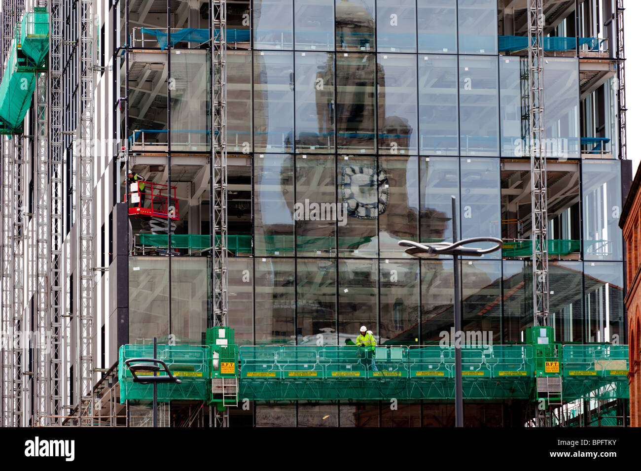 Reflections of the Liver Building in the glass of an apartment block ...