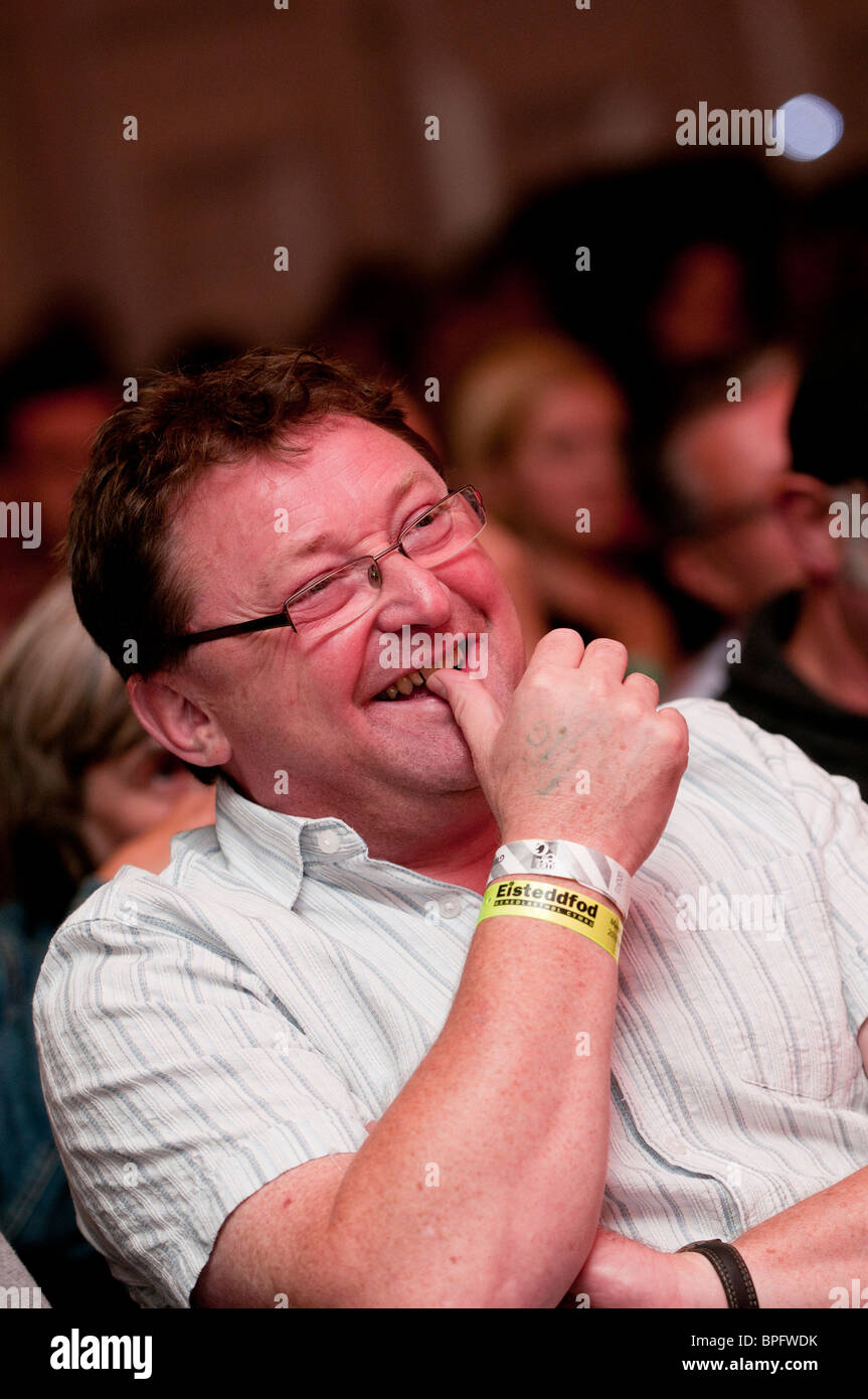 a man enjoying listening to the unofficial fringe "Stomp" poetry ...