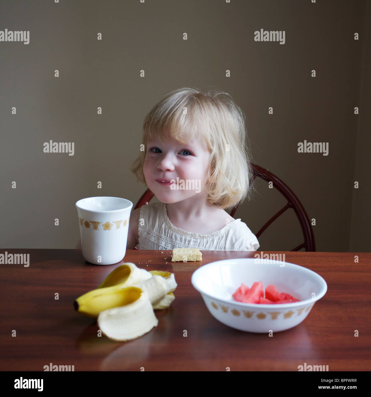 A little girl having a breakfast Stock Photo - Alamy