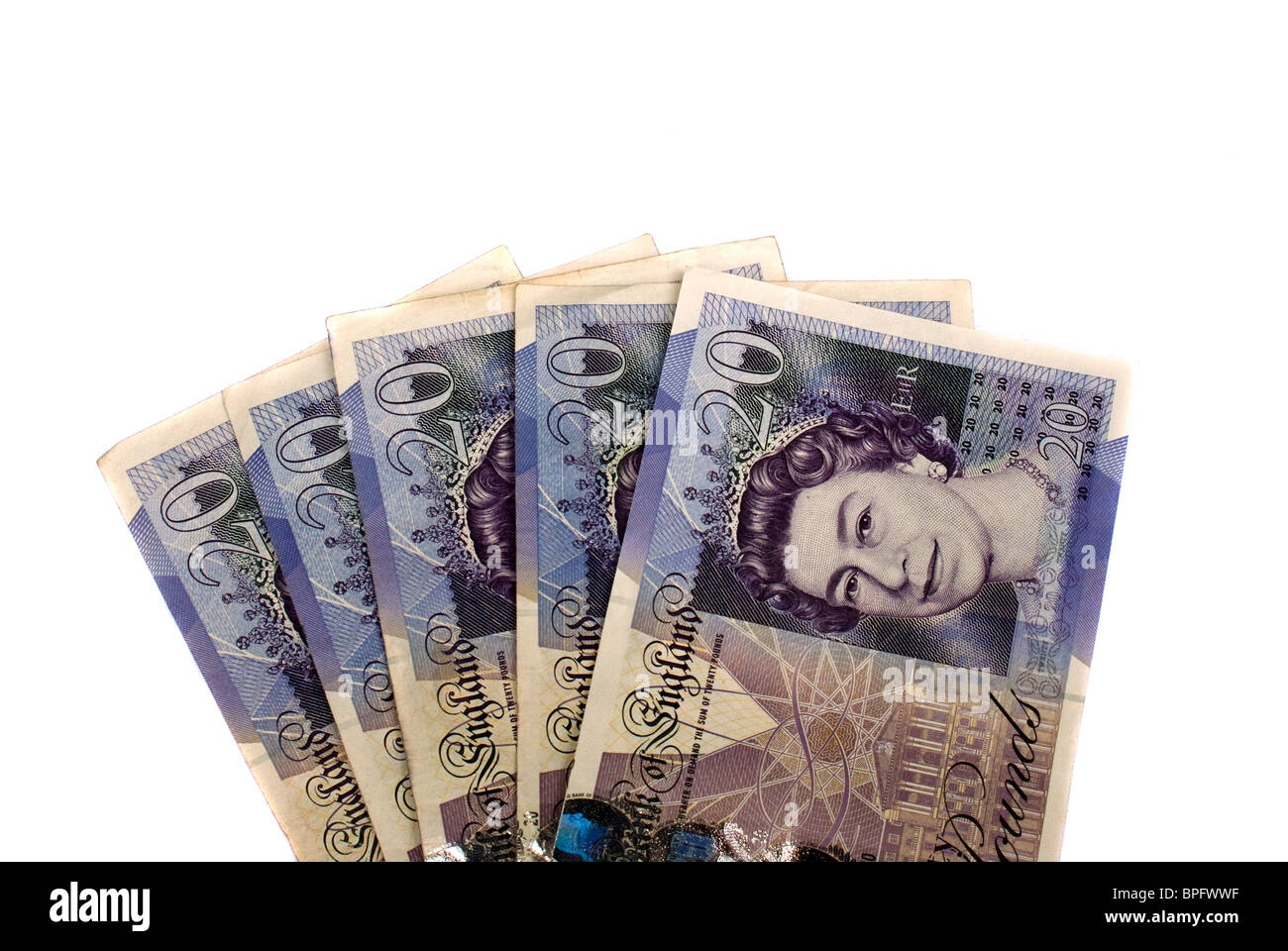 A fan of twenty (£20) pound sterling notes isolated on a white ...