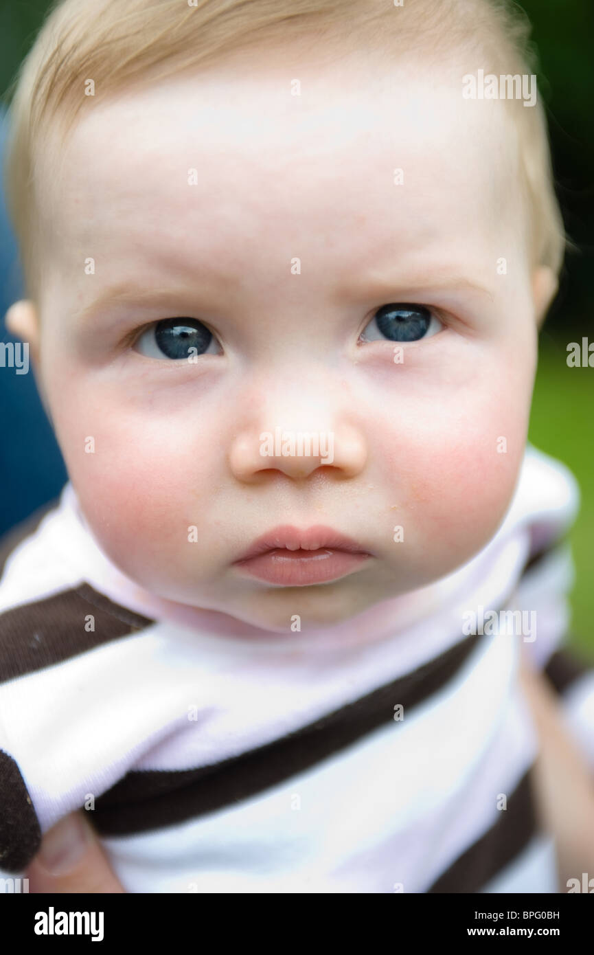 A baby looks at the camera Stock Photo - Alamy