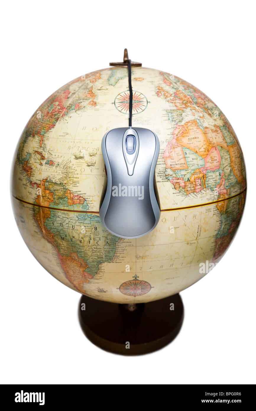 Computer mouse hanging on an earth globe Stock Photo - Alamy