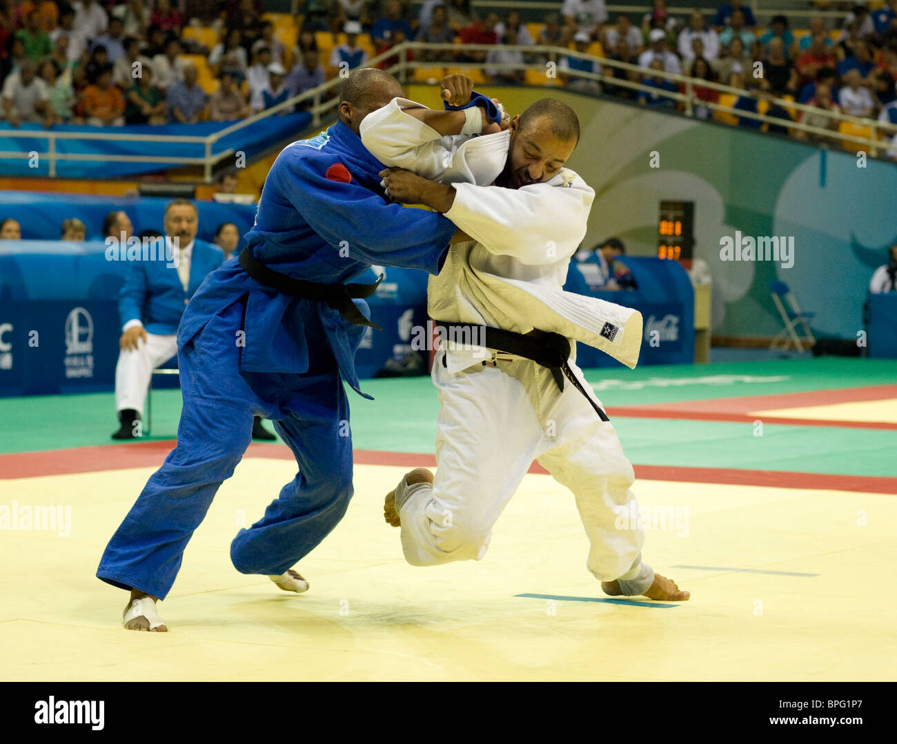Andre Watson of the US fighs off Messaoud Nine of Algeria in 90kg judo ...