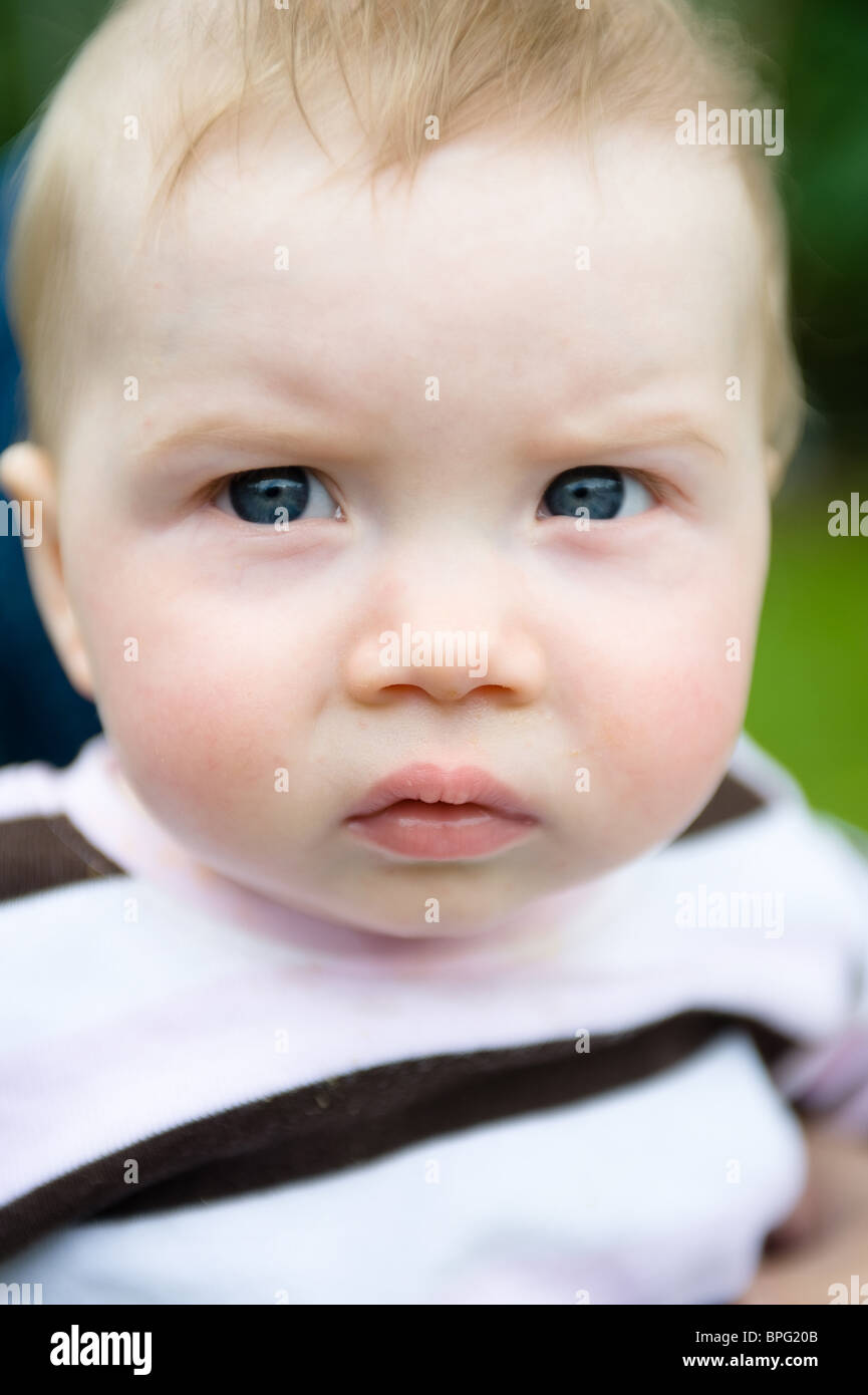 A baby looks at the camera Stock Photo - Alamy
