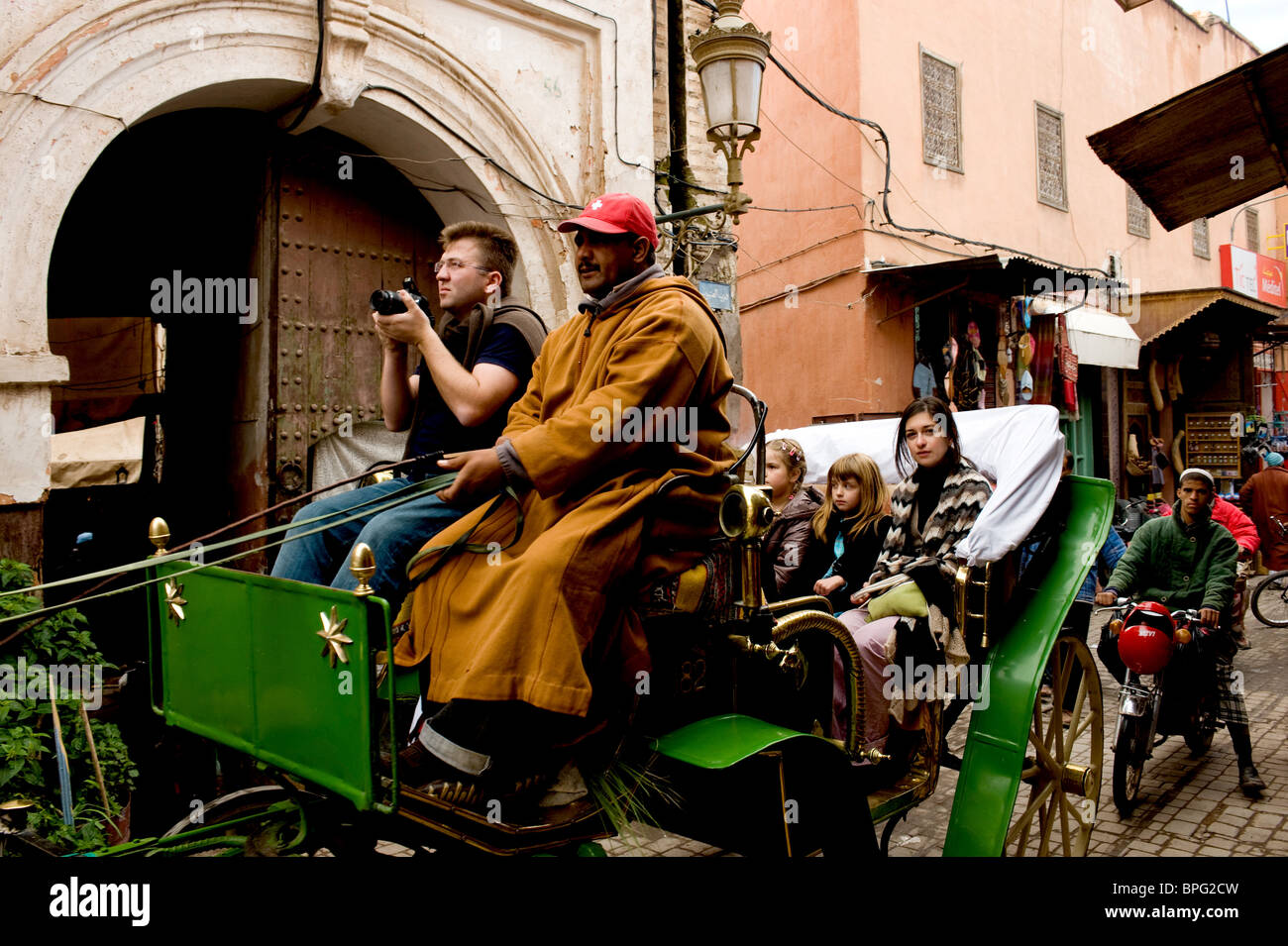 A tourist with camera riding on cart in Marrakesh, Morocco Stock Photo ...