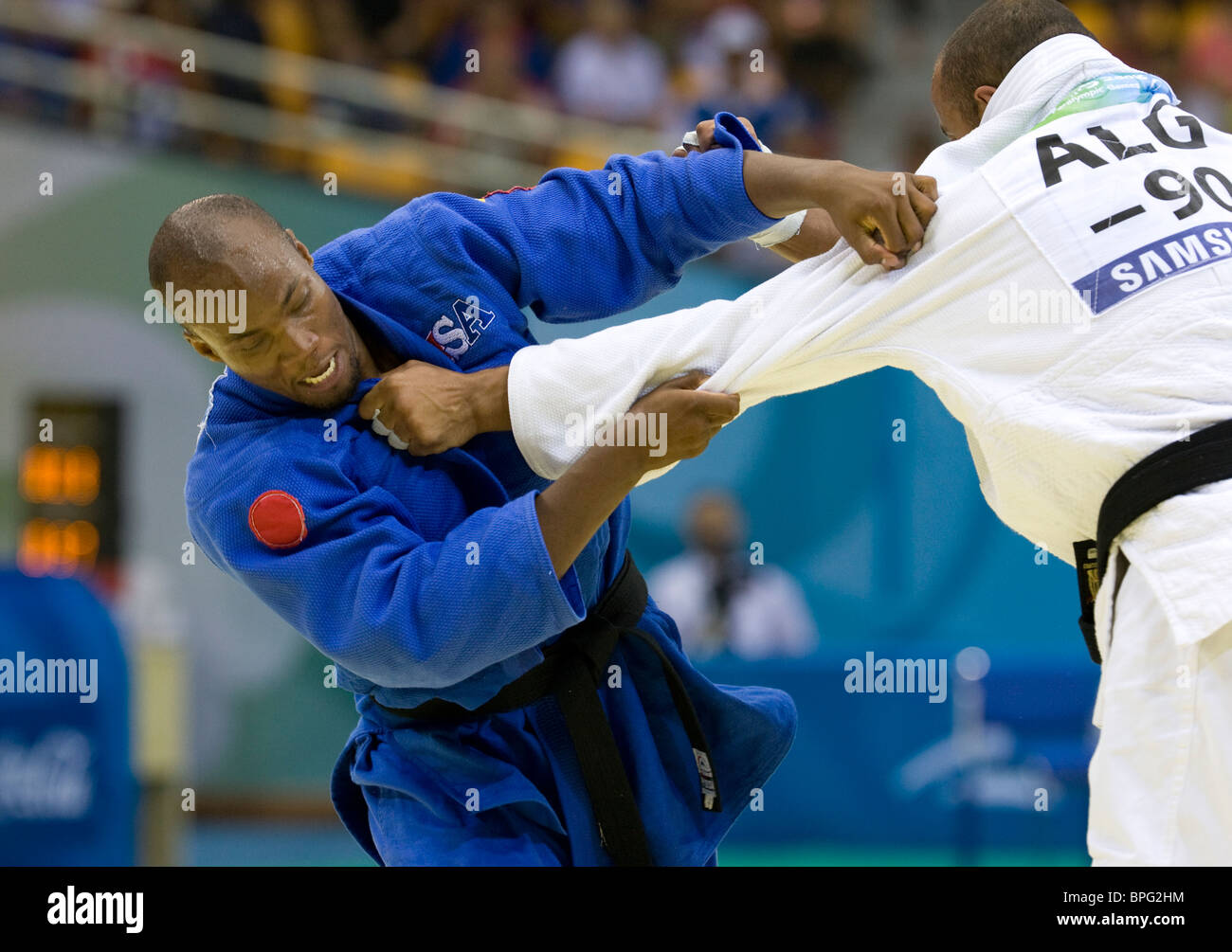 Andre Watson of the US fighs off Messaoud Nine of Algeria in a men's ...