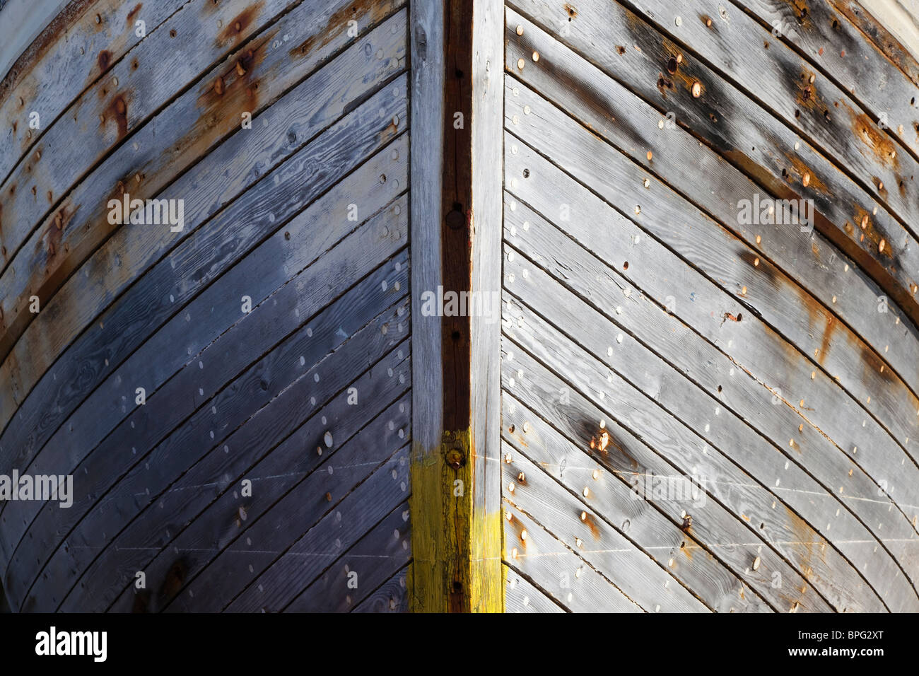 Wooden hull of an old fishing boat, shipyard, Troon, Ayrshire, Scotland ...