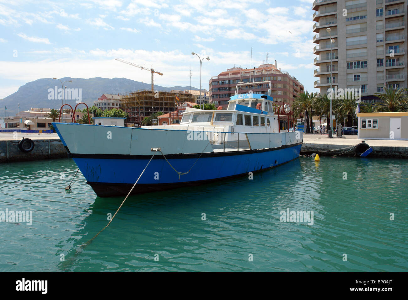old fish ship docking in a harbour of small town Stock Photo - Alamy