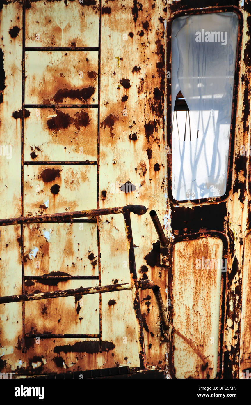 Weathered industrial crane and rusty ladder detail Stock Photo - Alamy