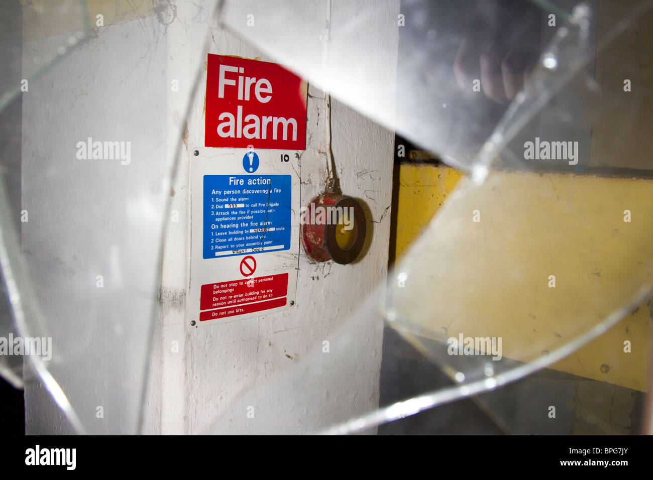 In case of fire break glass, shattered pane in front of fire sign ...