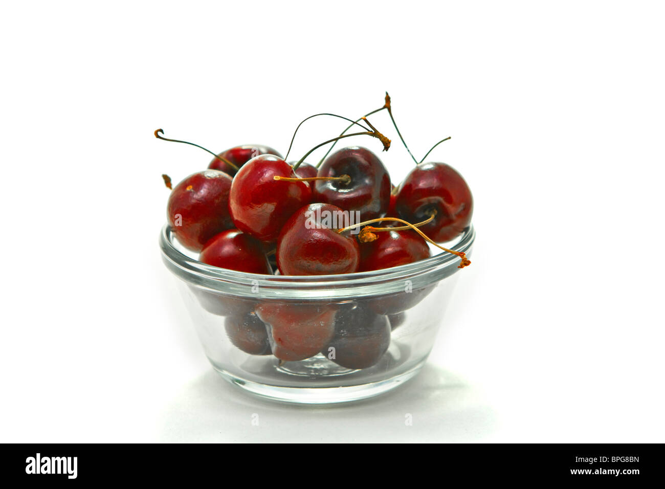 Small clear bowl of ripe red cherries Stock Photo - Alamy