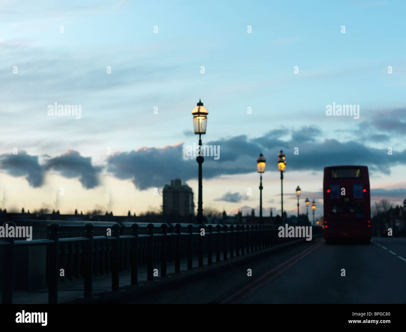London England Bus Going Over Battersea Bridge In The Evening Stock ...
