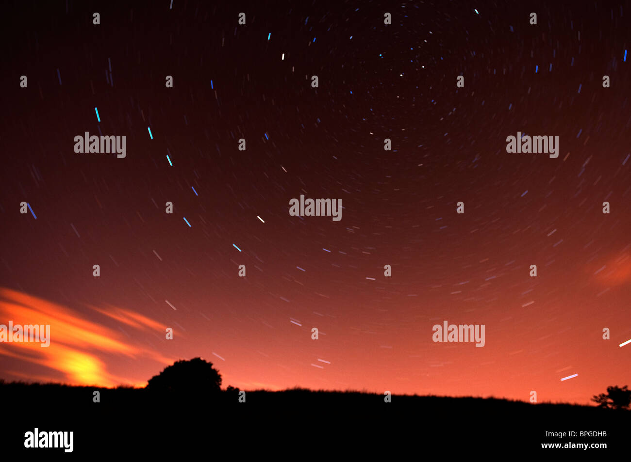 Star trails are seen in the night sky Stock Photo - Alamy