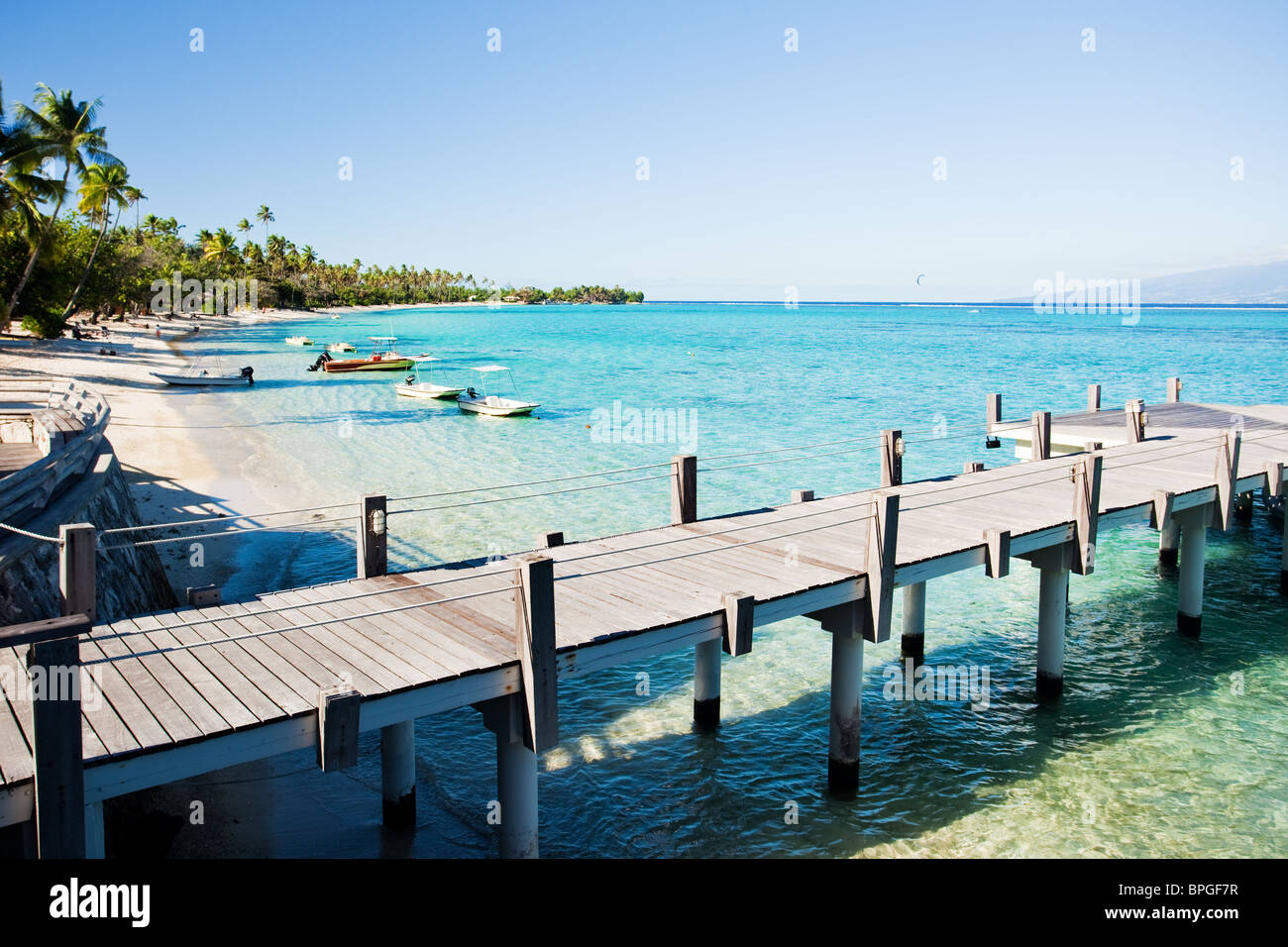Little jetty and boat on tropical beach with amazing water Stock Photo ...