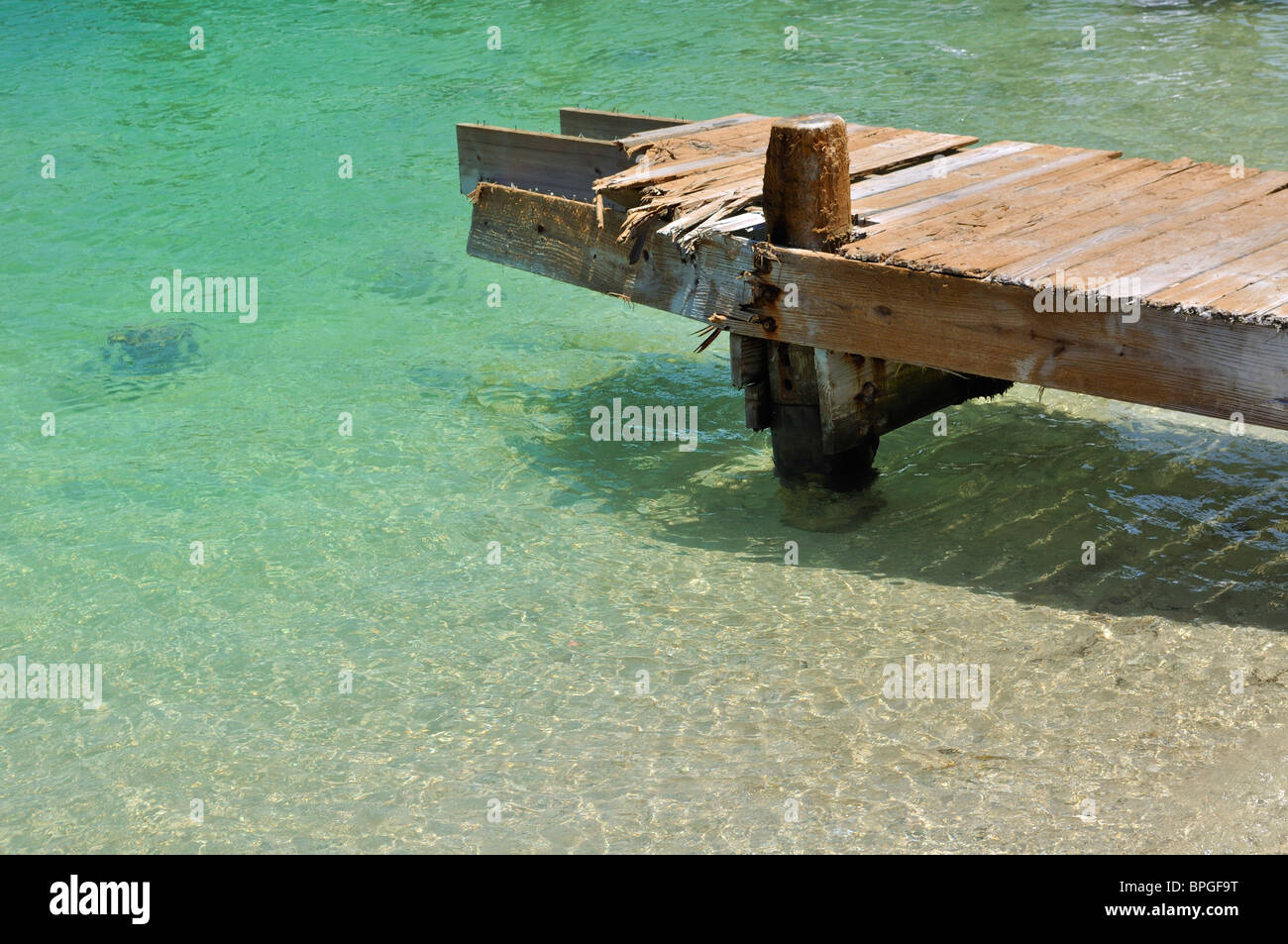 Old decaying boat dock into turquoise waters off Key west, Florida ...