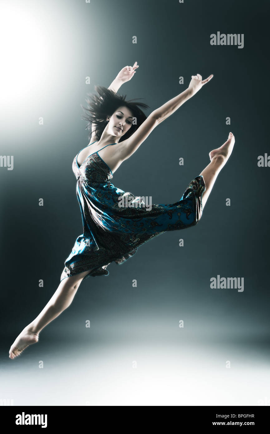 Stylish and young modern style dancer is jumping stretched Stock Photo ...