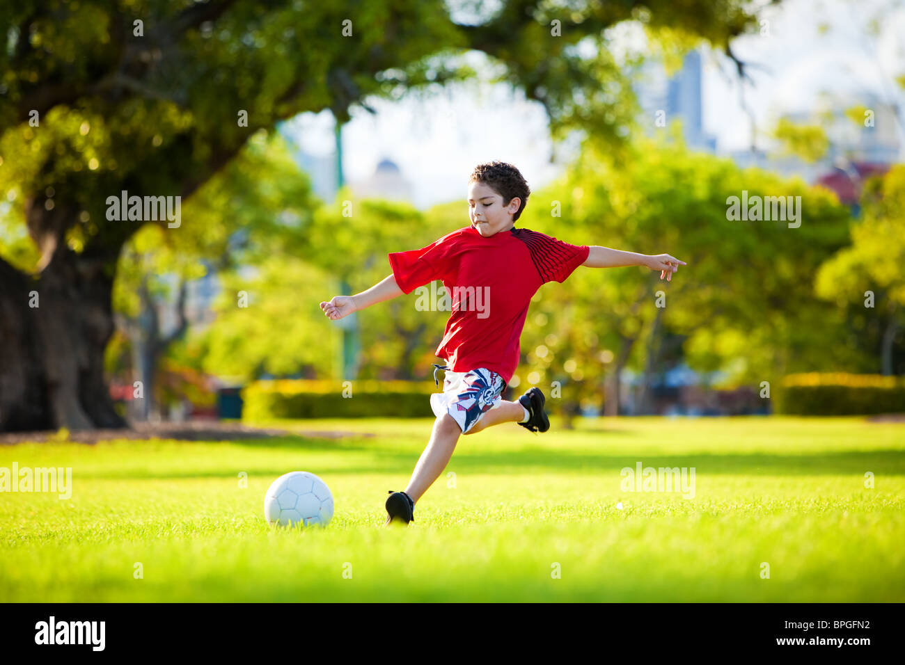 Football kick grass hi-res stock photography and images - Alamy