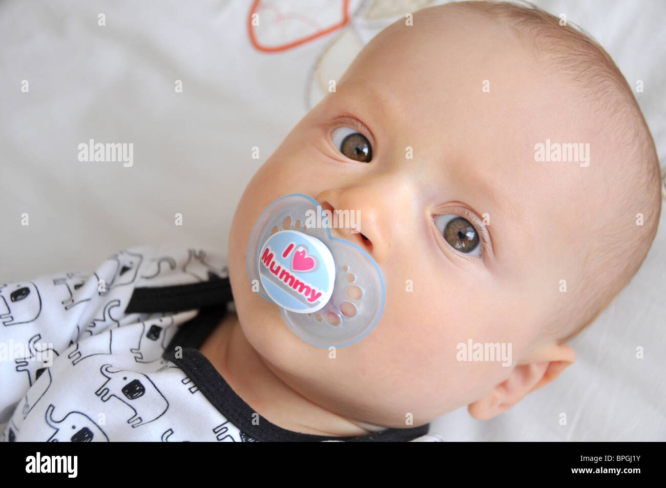 Baby with a dummy Stock Photo - Alamy
