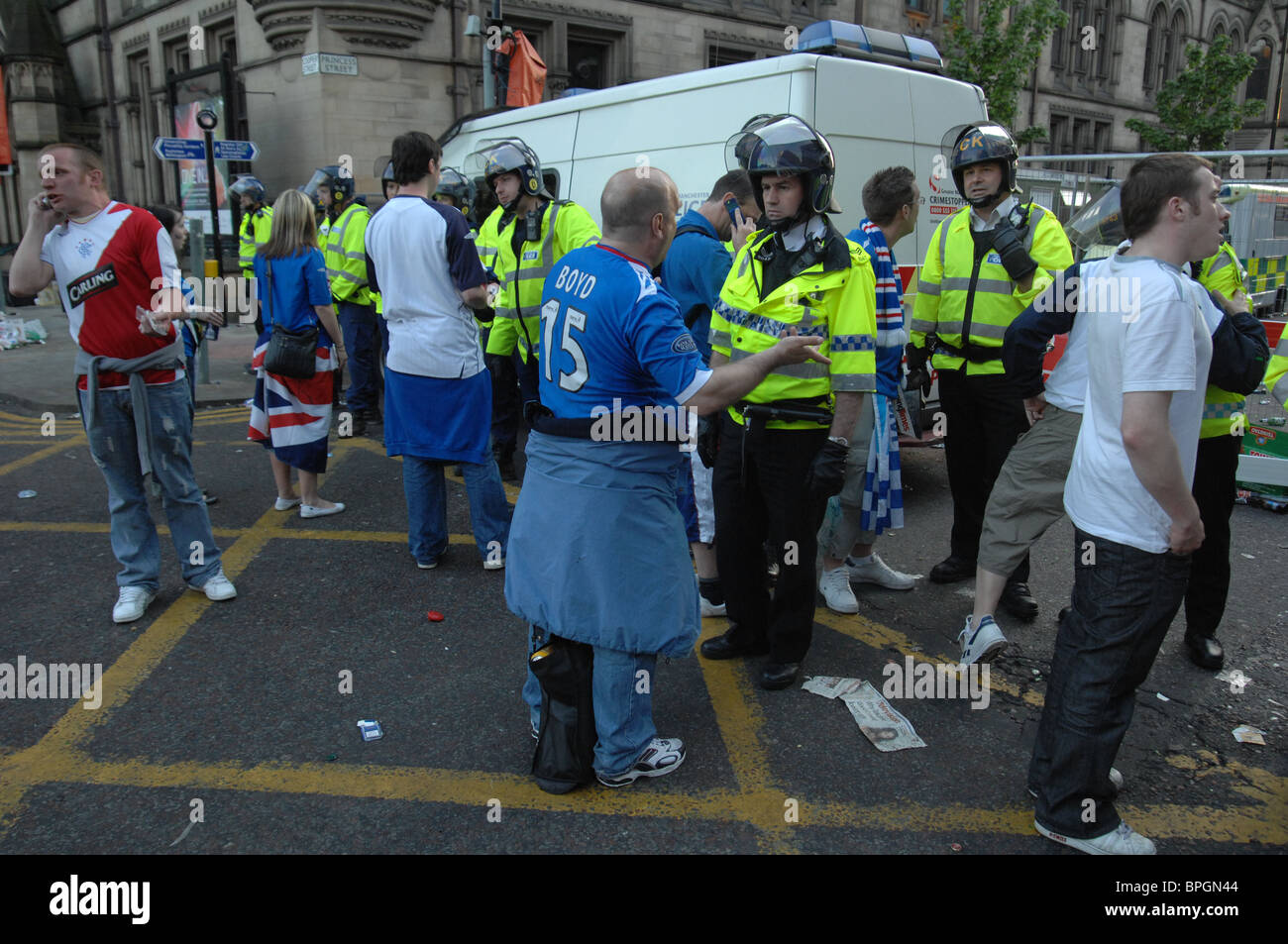 Rangers fans and Police vans and police in riot gear in Manchester for ...