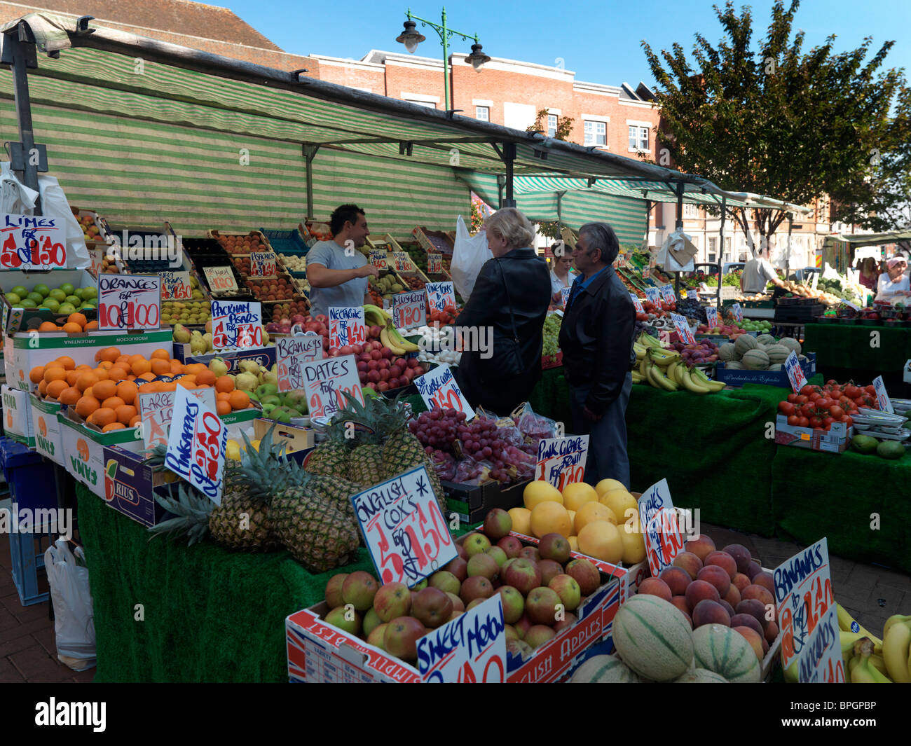 People buying fruit and vegetables at market stall hi-res stock ...