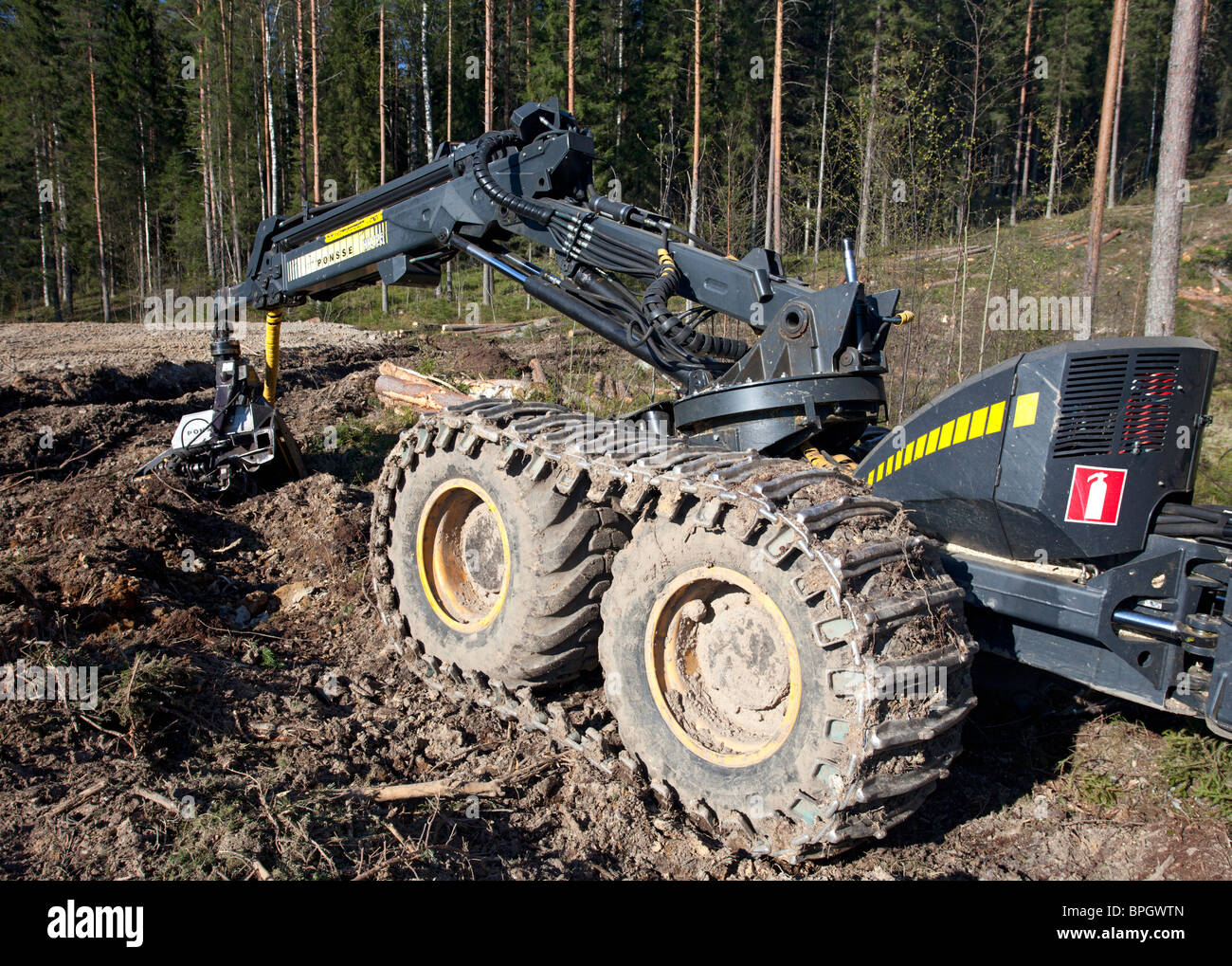 Ponsse Beaver forest harvester boom, cutting head and tire tracks ...