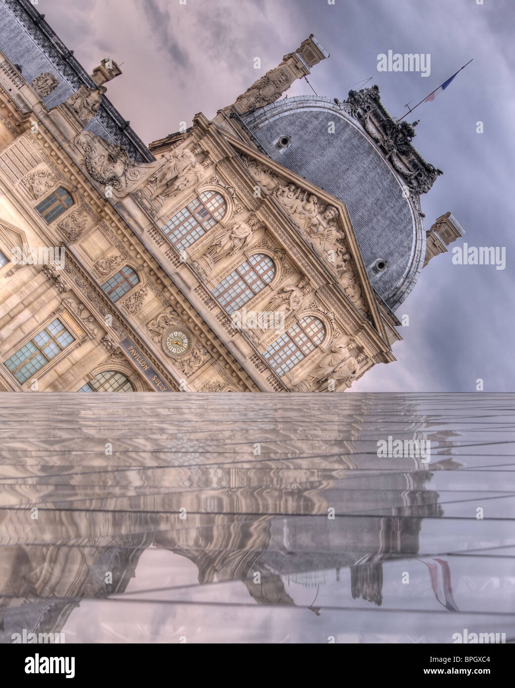 The Louvre reflects from I.M. Pei's Pyramid, as storm clouds gather ...