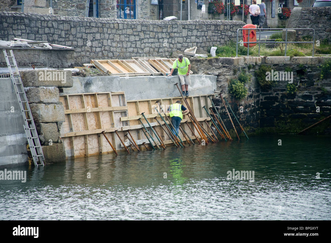 Working at Height on Porthleven Sea wall, Cornwall, UK Stock Photo - Alamy