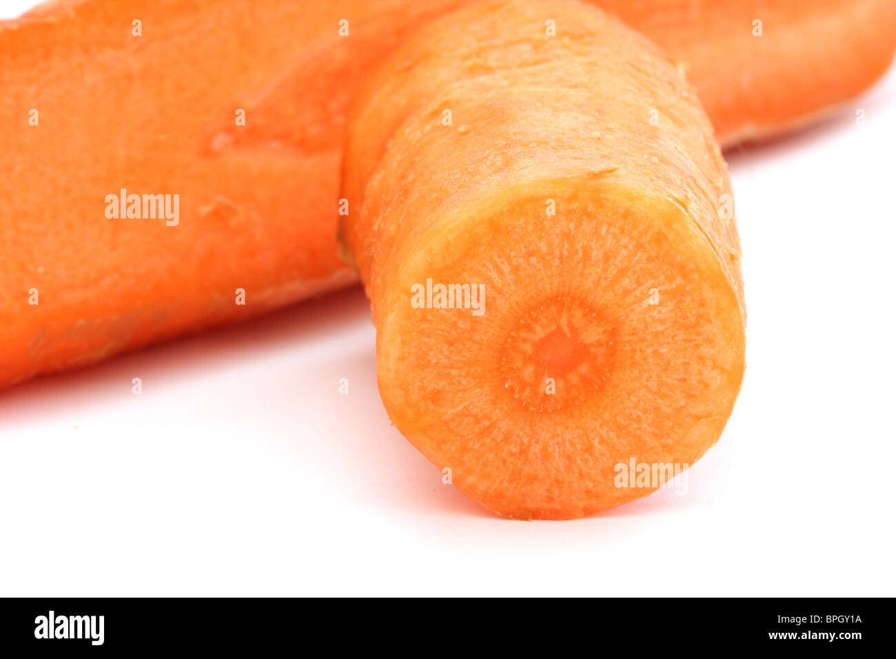 Cut carrot on white background Stock Photo - Alamy
