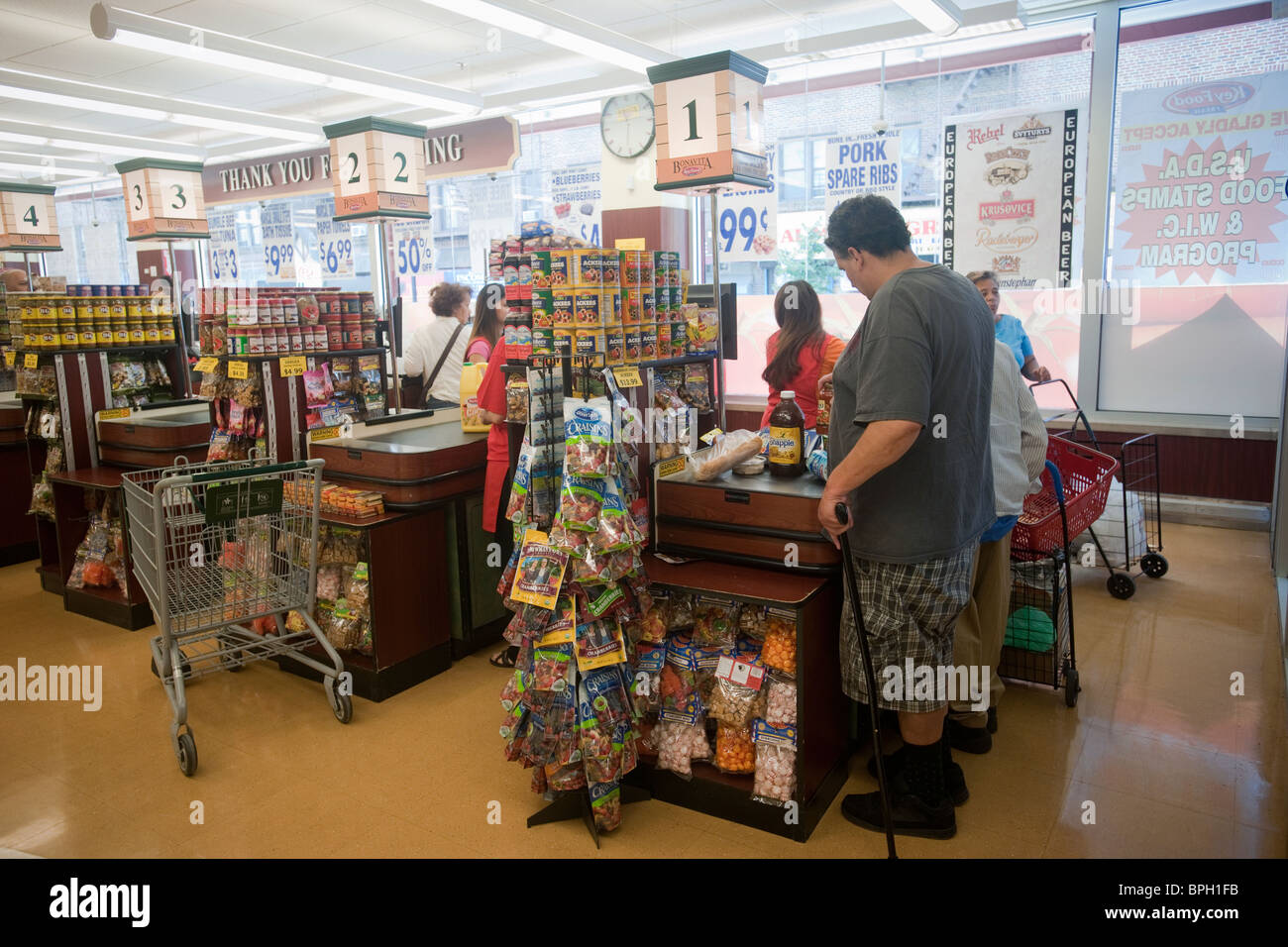 Shoppers at the check-out cashiers in a supermarket in the New York ...