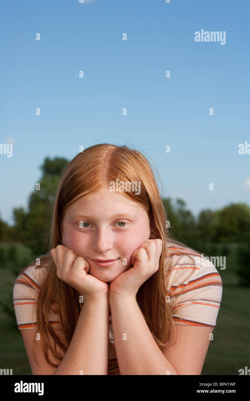 Tween girl red 11 13 years smile hi-res stock photography and images ...