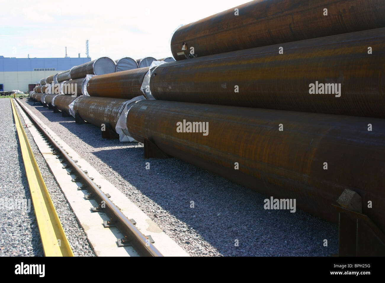 Big diameter ferrous metal pipes are on the storage yard Stock Photo ...