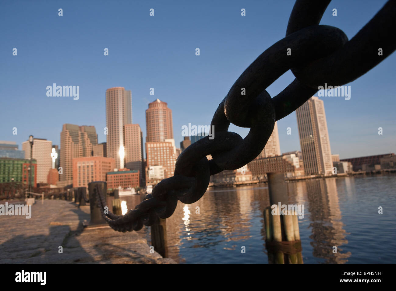 Anchor chain with city skyline in background, Rowes Wharf, Boston ...
