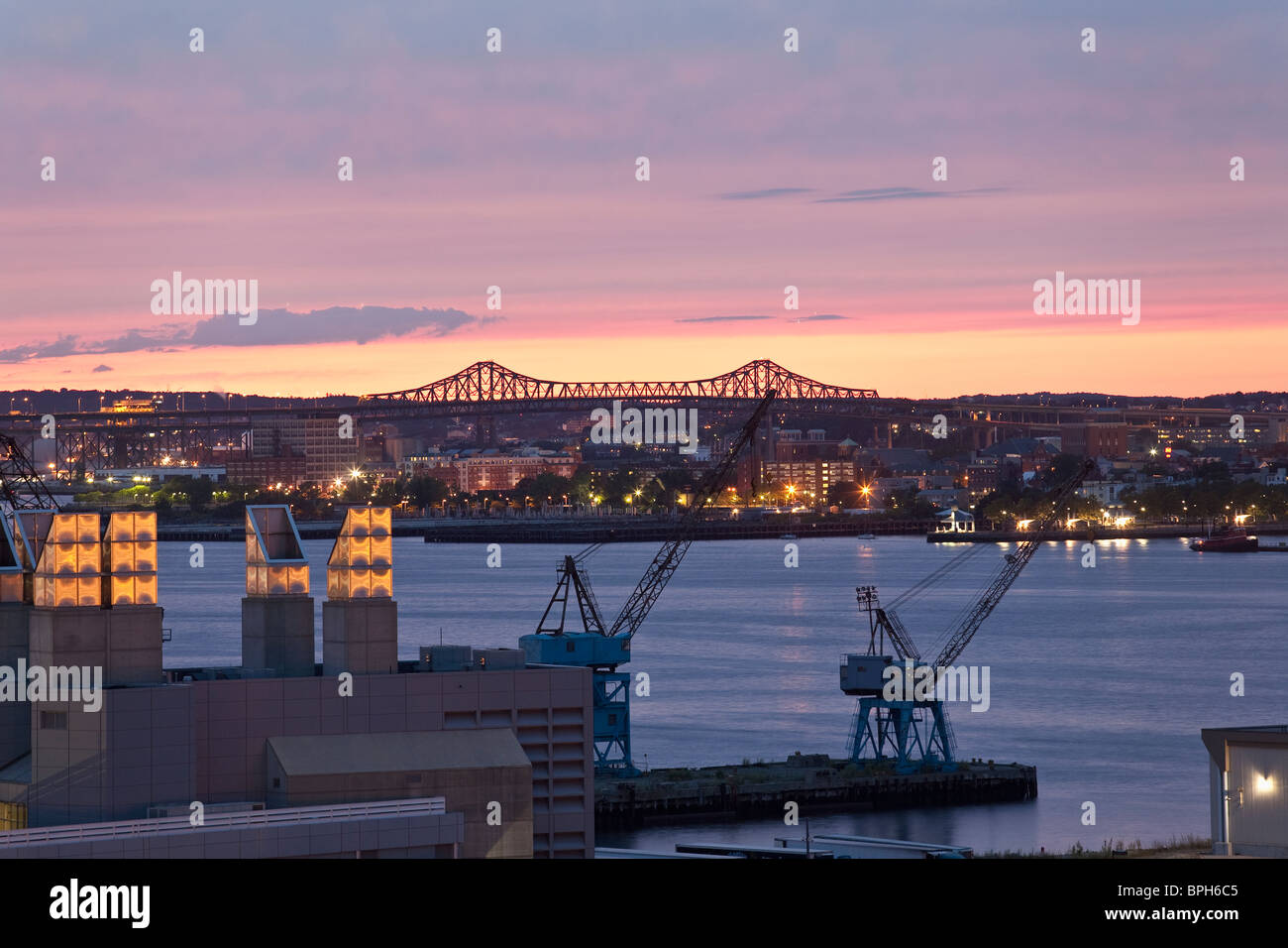 Cranes at a harbor with a bridge in the background, Tobin Bridge ...
