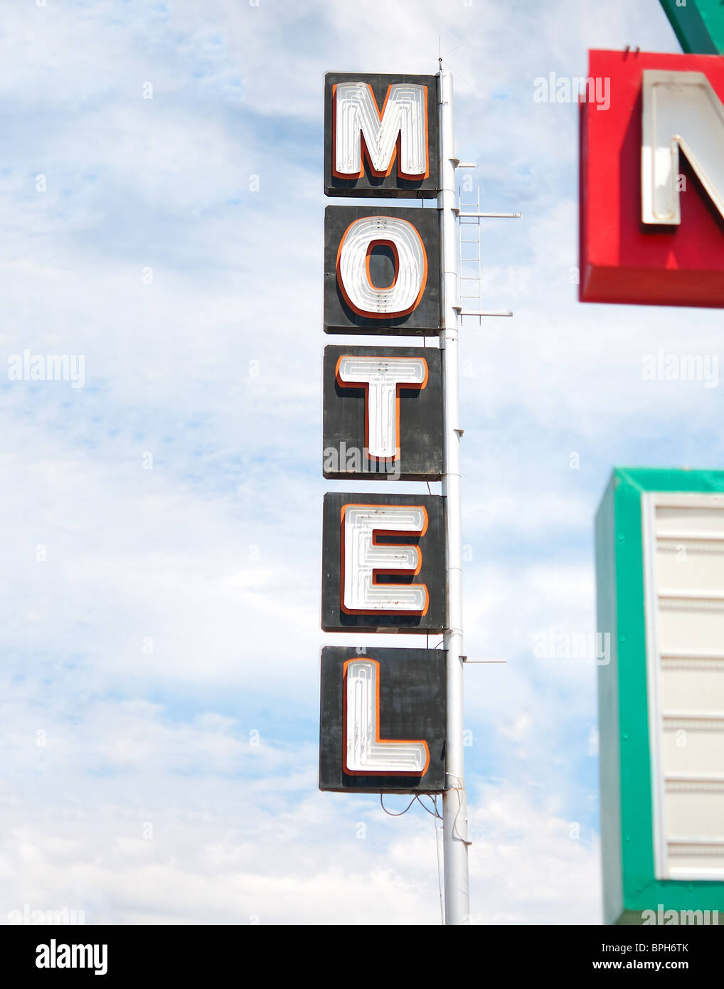 Retro neon motel road sign Stock Photo - Alamy