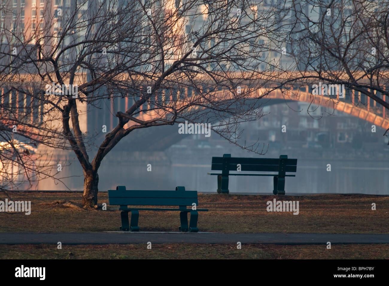 Benches at the riverside with an arch bridge in background, Longfellow ...