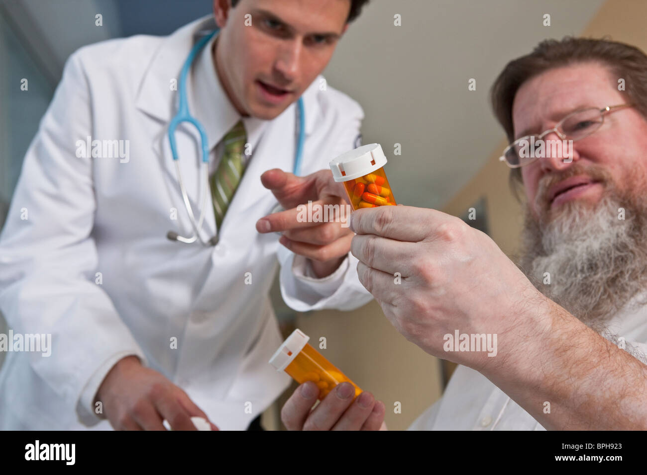 Doctor explaining a patient about medicine Stock Photo - Alamy