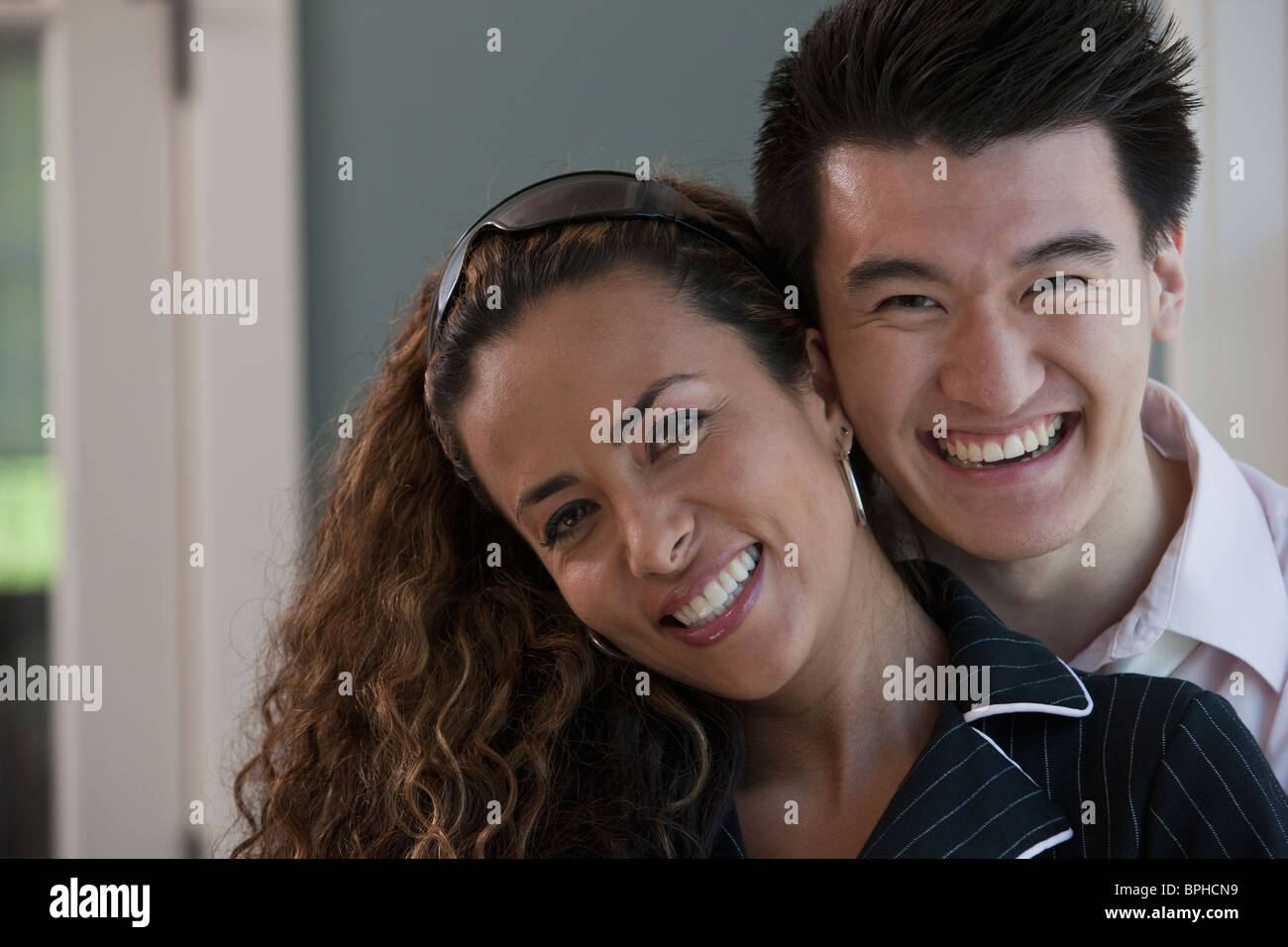 Portrait of a visually impaired Hispanic woman smiling with a man Stock ...