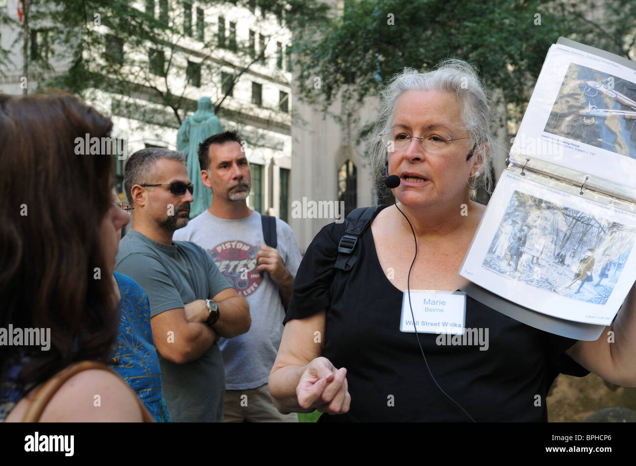 A guide at the grave of Alexander Hamilton in Trinity Churchyard, Lower ...